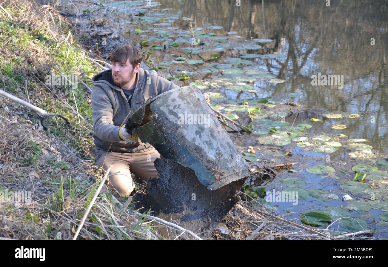 Daniel Learn, 502nd Civil Engineer Squadron, retrieves a barrel from ...