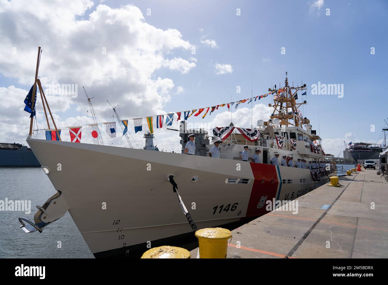 The Coast Guard Cutter John Scheuerman's crew stand at attention during ...