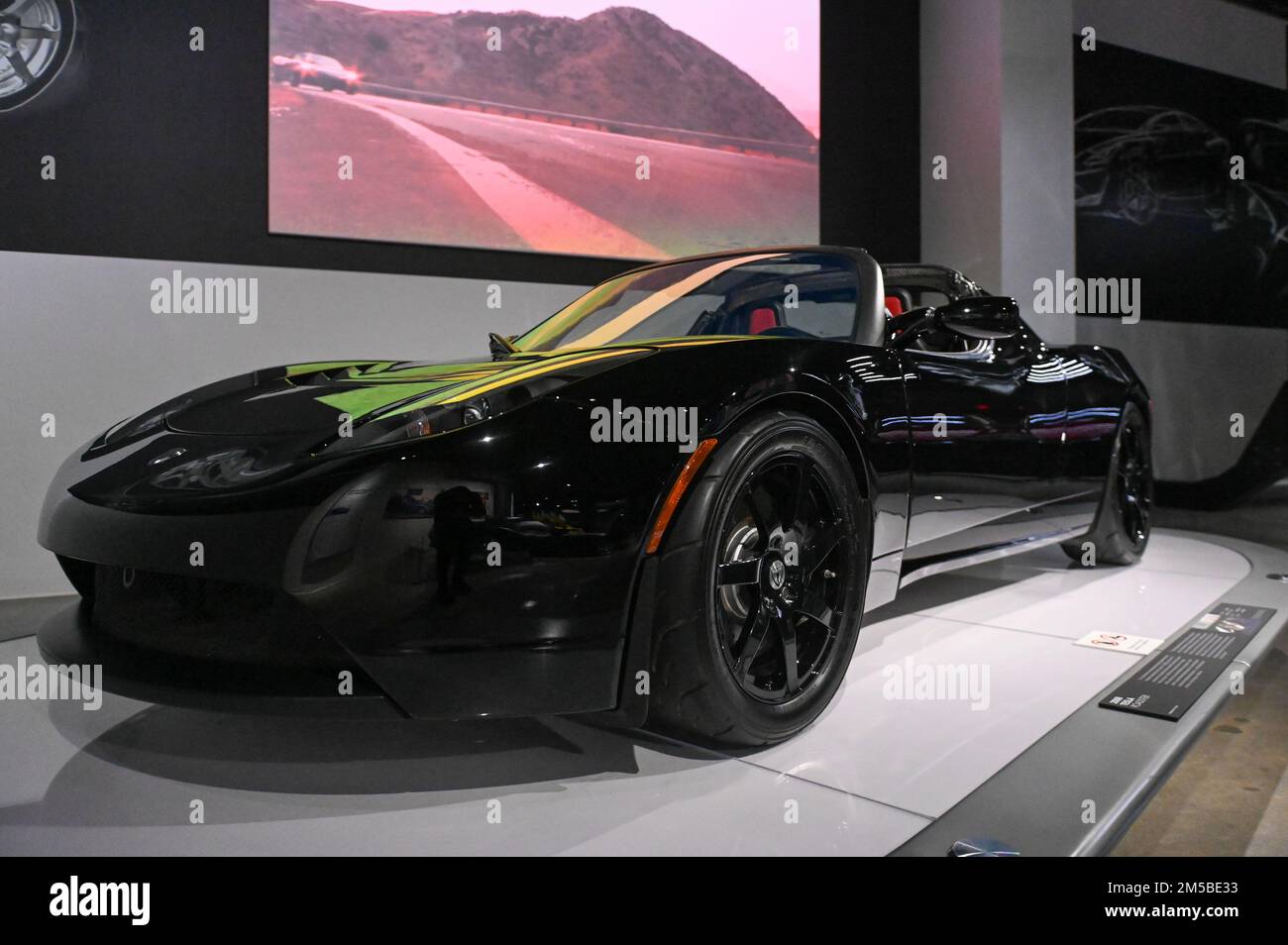 A 2008 Tesla Roadster sits on display at the Petersen Automotive Museum ...
