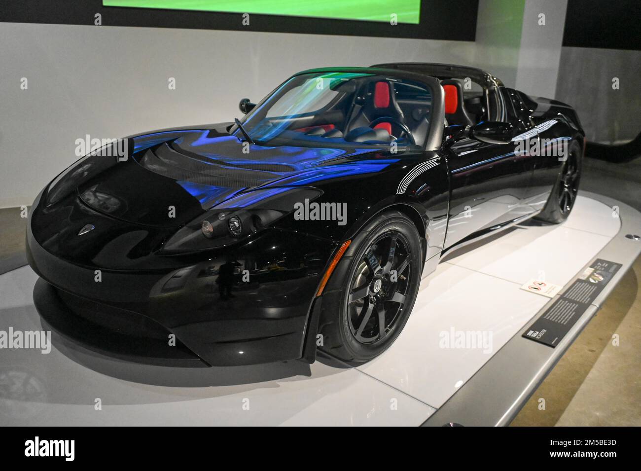 A 2008 Tesla Roadster sits on display at the Petersen Automotive Museum ...