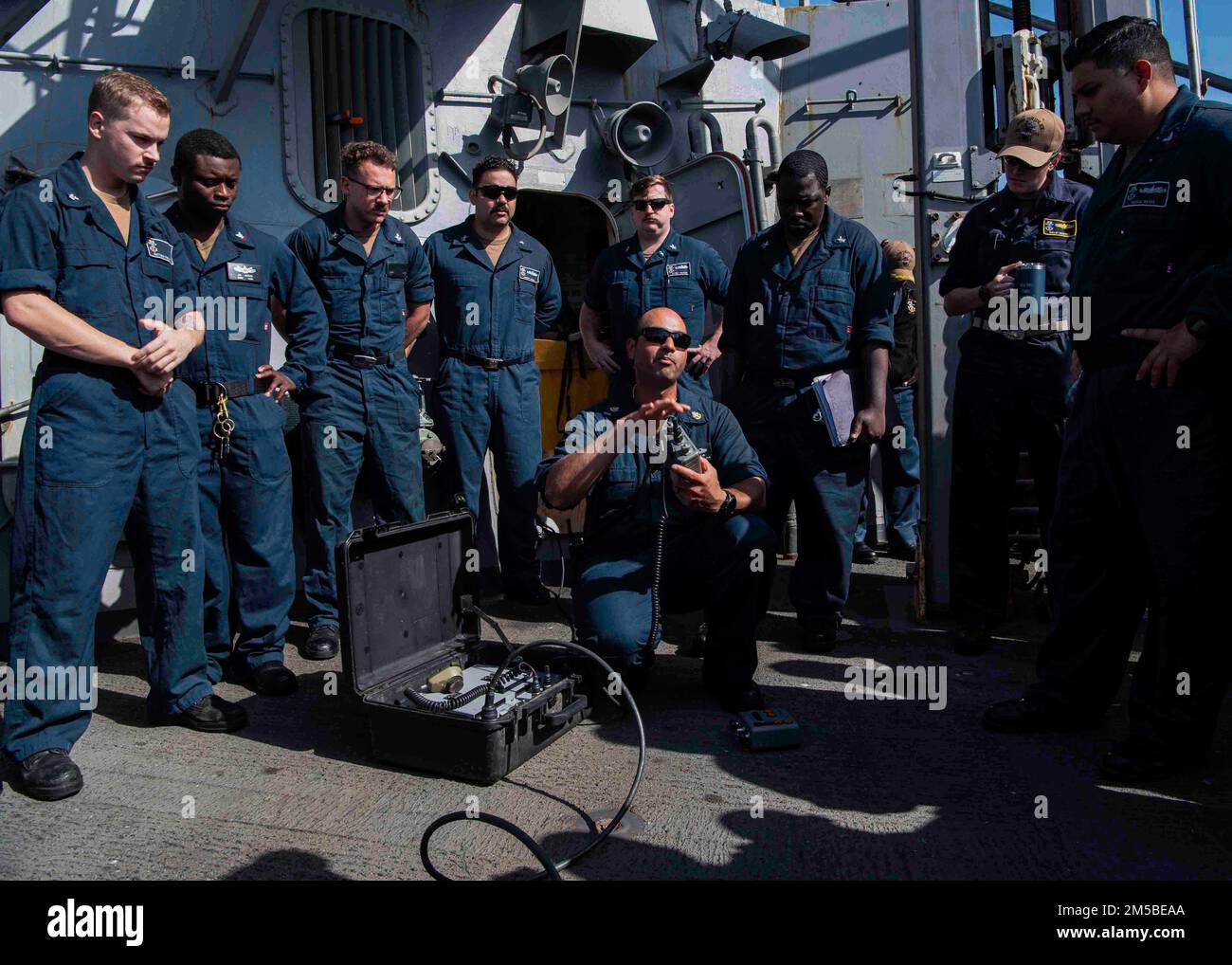 GULF OF OMAN (Feb. 21, 2022) Chief Gunner’s Mate Enrique Cruz, middle ...