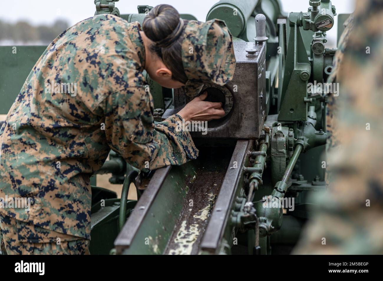 U.S. Marine Corps Cpl. Teresa Amaya, a cannon loader with Kilo Battery ...