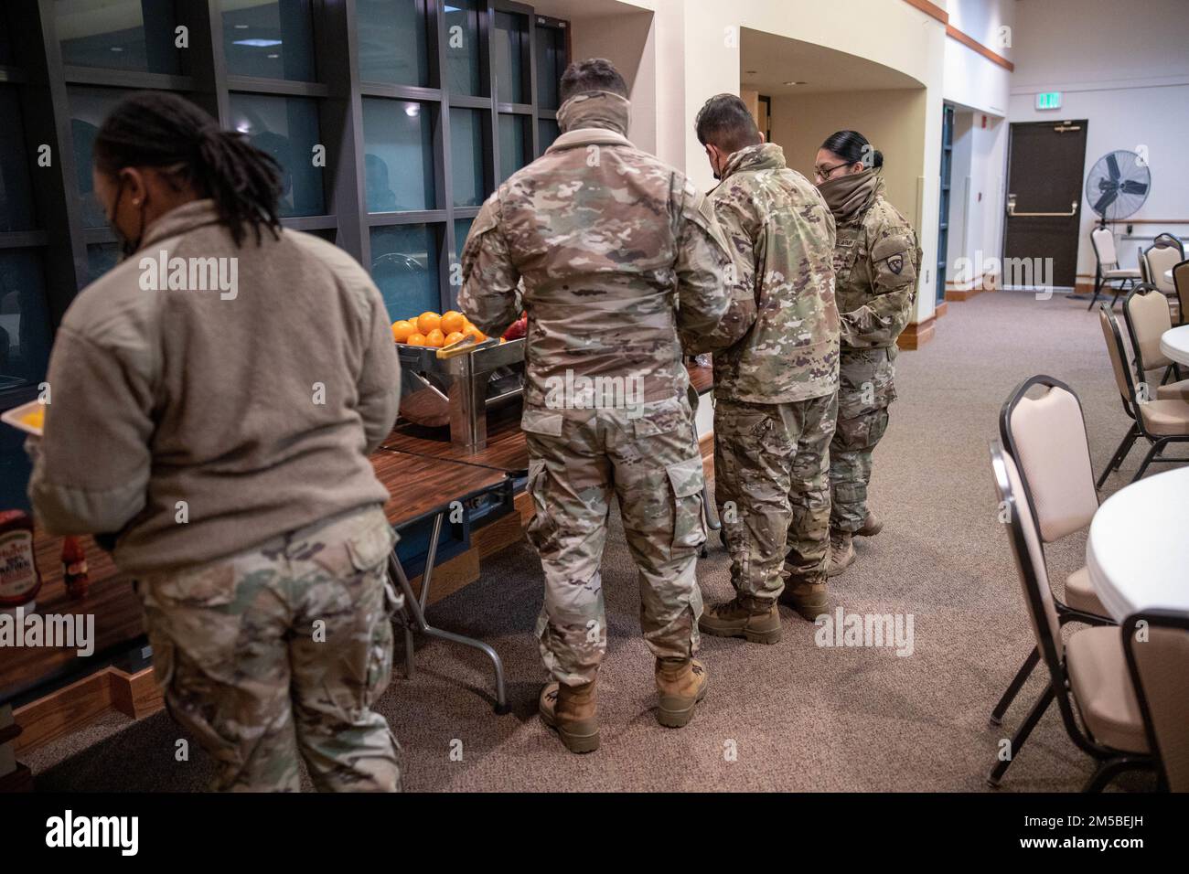 U.S. Soldiers participating in Arctic Edge 22, receive food and drinks ...