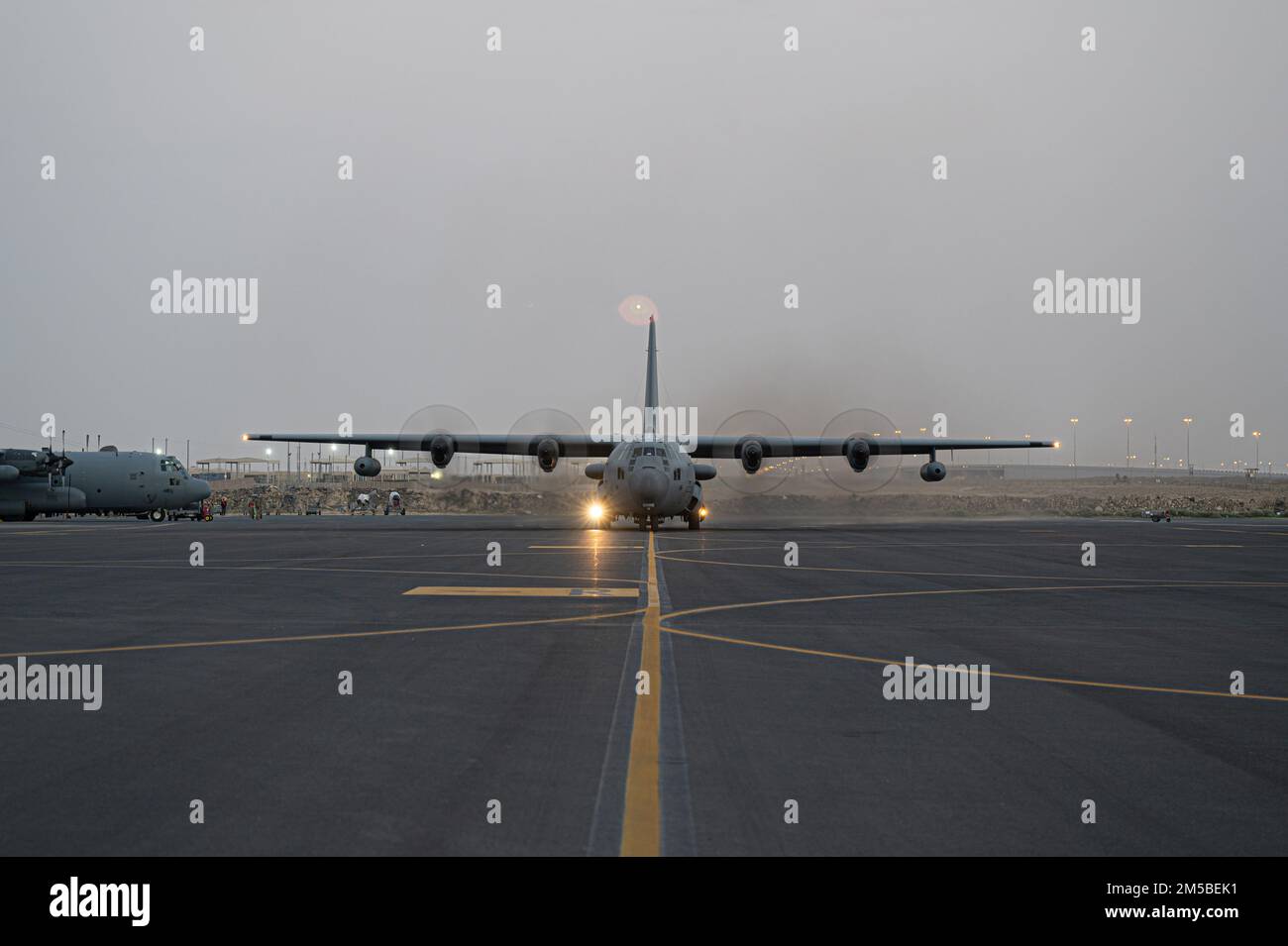A U.S. Air Force EC-130H Compass Call aircraft taxis to the runway at ...