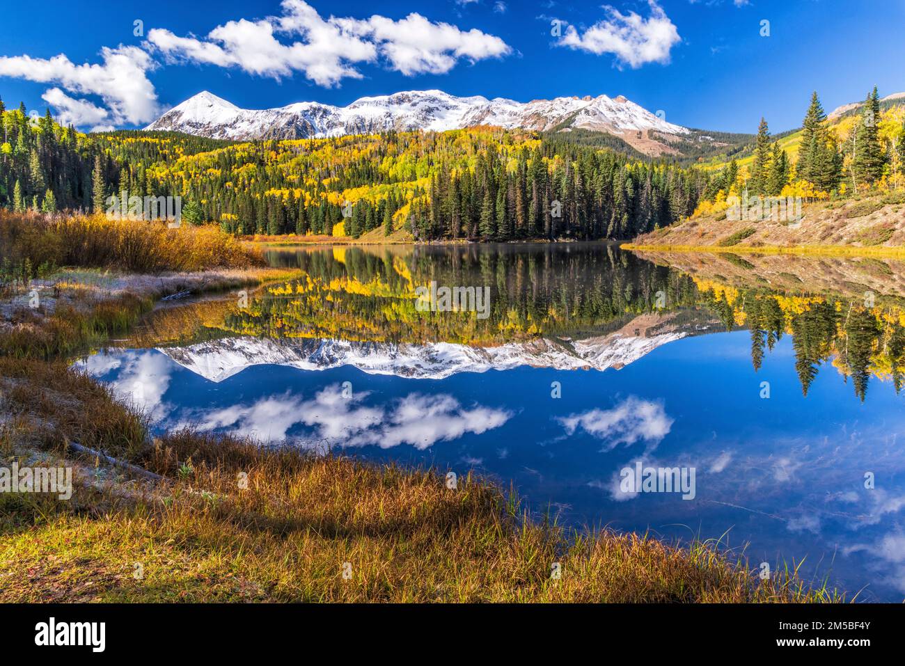 Snow Covered Dolores Peak And Middle Peak Reflected Is Calm Woods Lake In The Uncompahgre