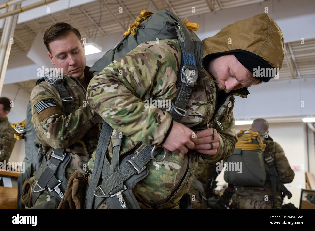 U.S. Air Force Staff Sgt. Asher Wilthew, left, assists Staff Sgt ...