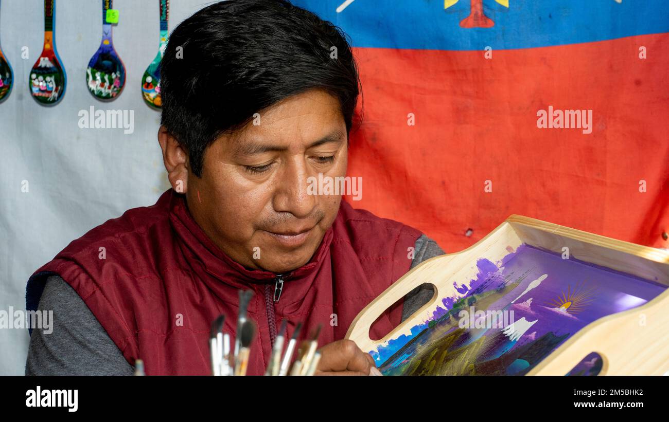 portraits of an Ecuadorian painter in his small business painting trays ...