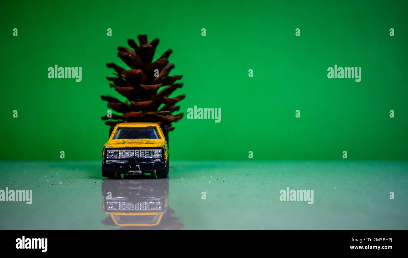 Minahasa, Indonesia : December 2022, toy car transporting pinecones ...