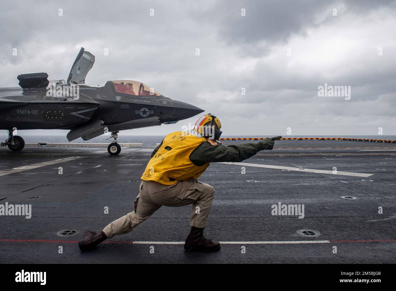 EAST CHINA SEA (Feb. 23, 2022) Command Master Chief Randy Bell, left ...