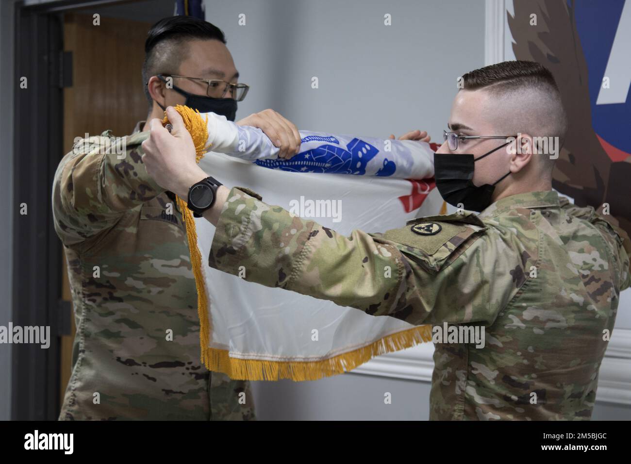 Spc. Calvin Guan and Spc. Jason A. W. Lansbury, Soldiers assigned to ...