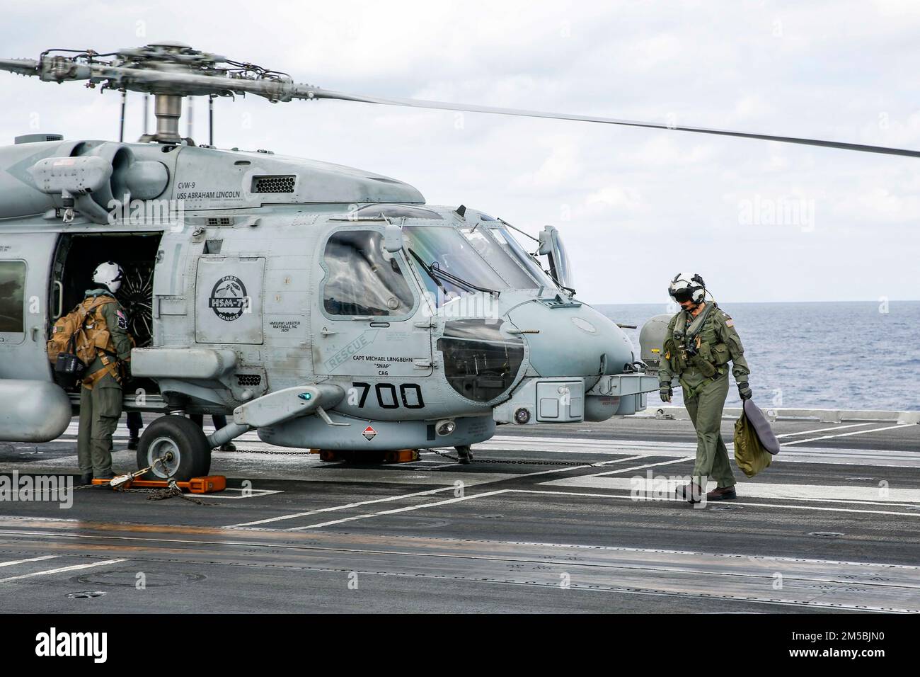 PHILIPPINE SEA (Feb. 23, 2022) Capt. Amy Bauernschmidt, right ...