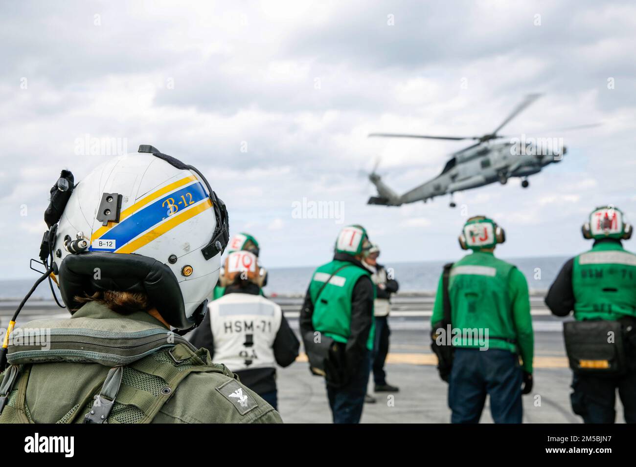 PHILIPPINE SEA (Feb. 23, 2022) Capt. Amy Bauernschmidt, left ...