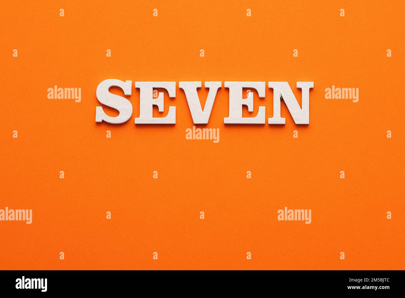 Seven phrase in white letters on orange foamy background Stock Photo ...