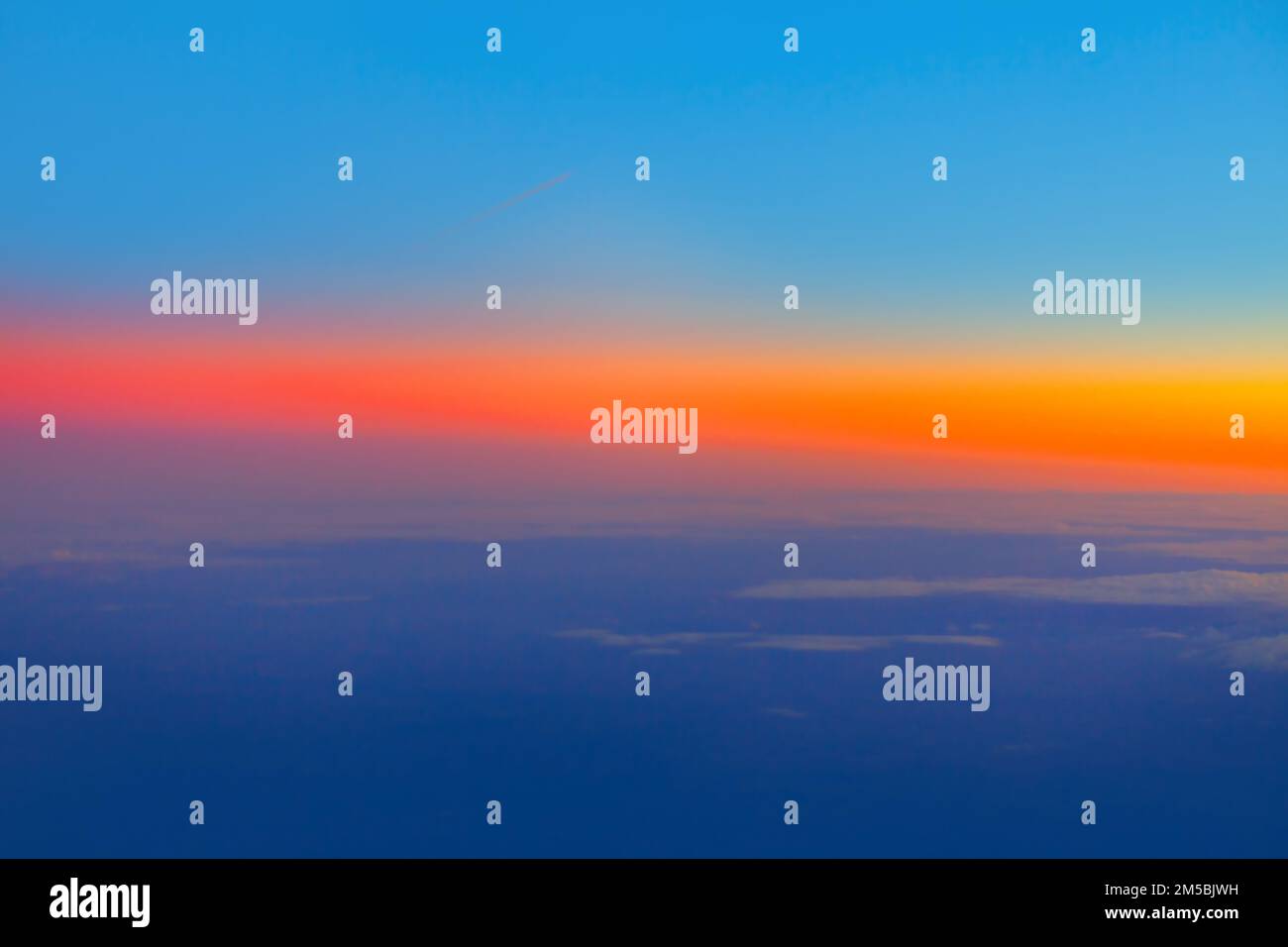 Sky with colorful dusk . Vibrant sky view during flight Stock Photo - Alamy