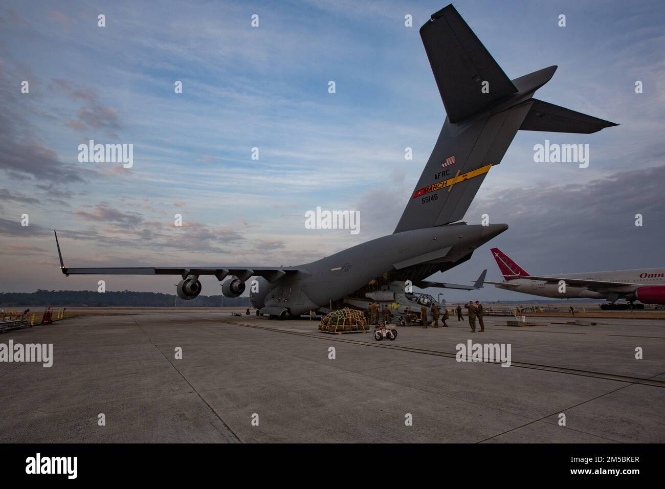 U.S. Marines with 2nd Marine Aircraft Wing and U.S. Airmen with 729th Airlift Squadron prepare ...