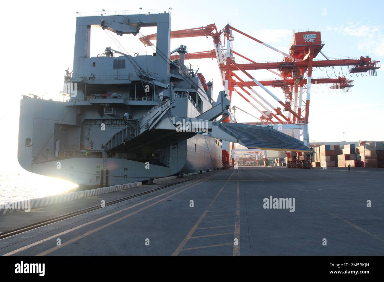 The ramp of U.S. Naval Ship Red Cloud lowers onto the Subic Bay port in ...