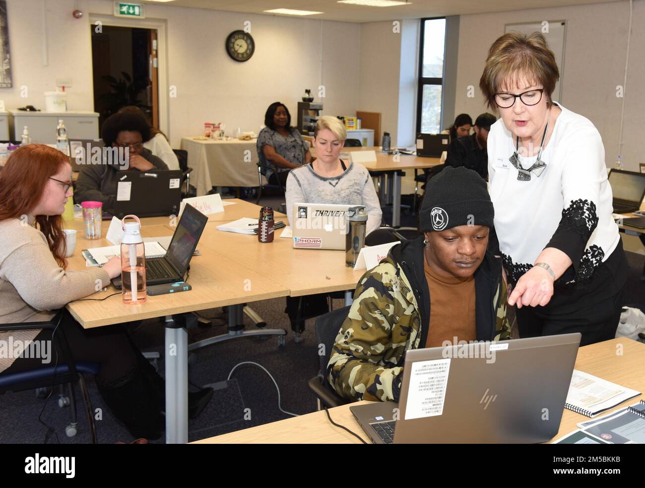 Ann Norris, right, standing, Department of Labor facilitator, explains ...