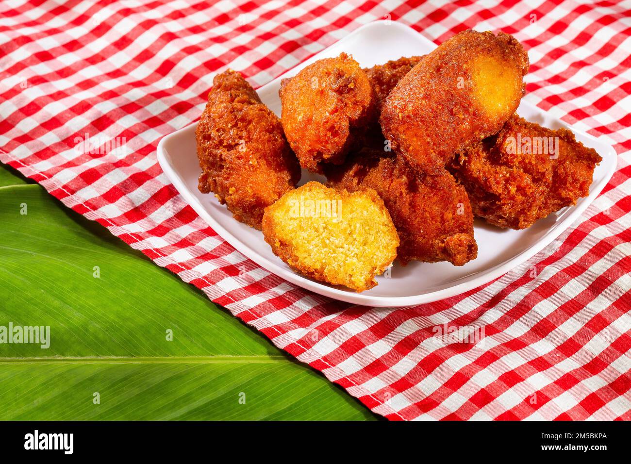 Fried tender corn croquettes - Colombian traditional food Stock Photo ...