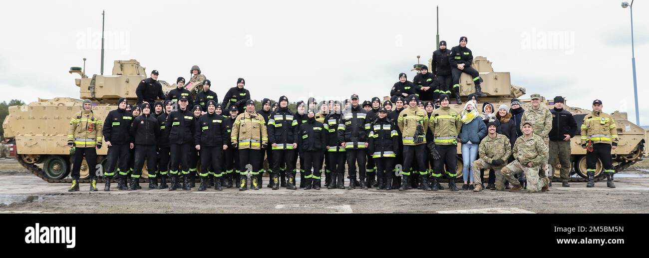 Polish firefighters pose with U.S. Soldiers in front of various ...
