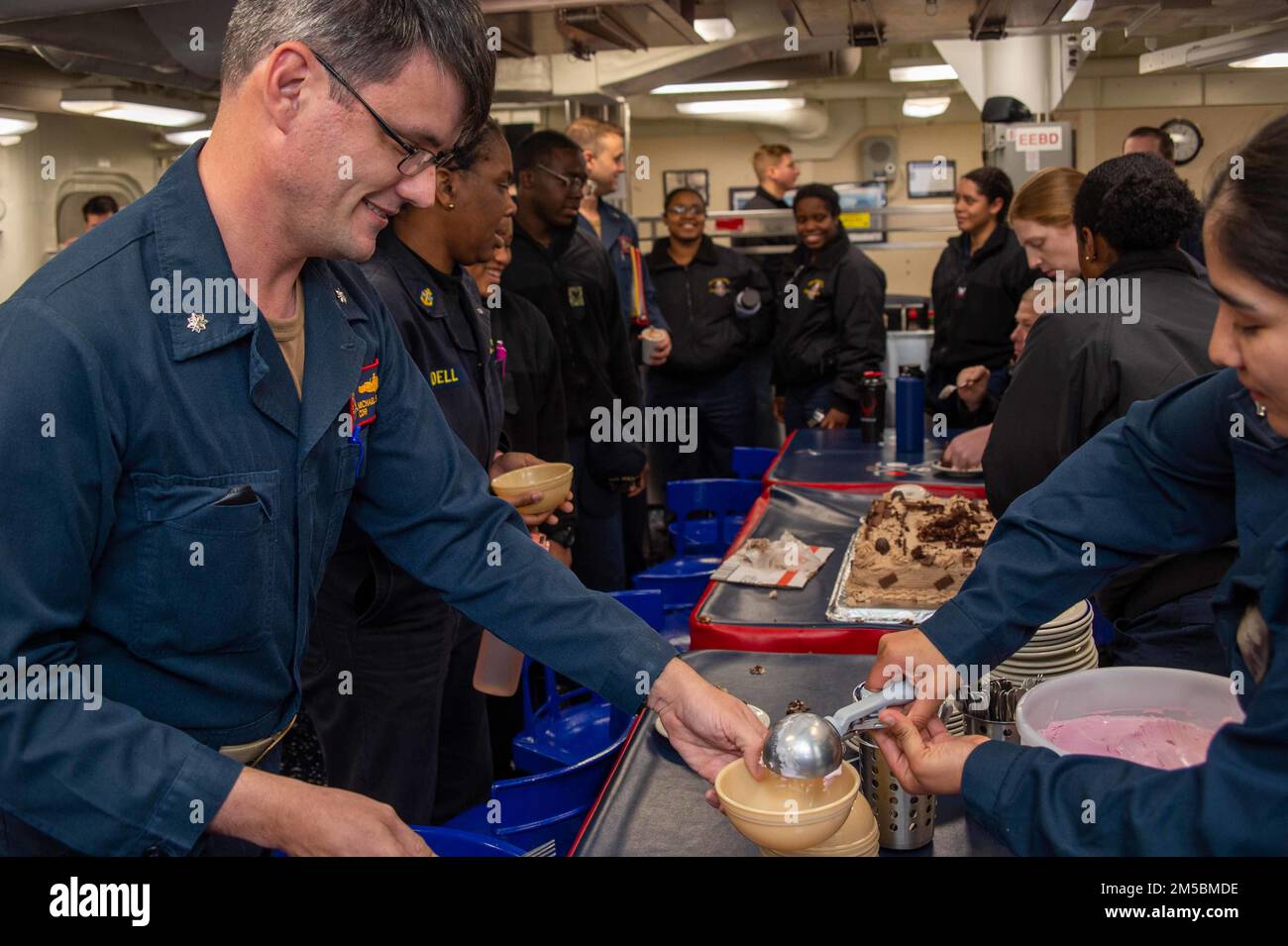 220223-N-UP745-1042 IONIAN SEA (Feb. 23, 2022) Cmdr. Michael Kiser, left, commanding officer ...