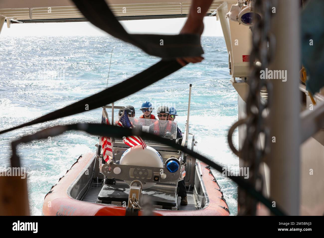 Boatswain’s Mate 1st Class Bleyers William, pilots a ridged-hull ...