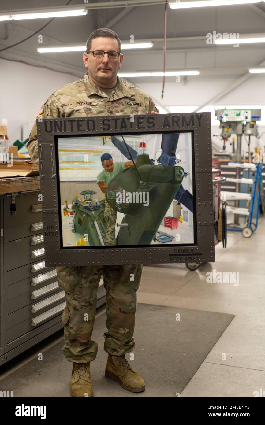 U.S. Army Staff Sgt. Stephen Foster displays his latest painting "High ...