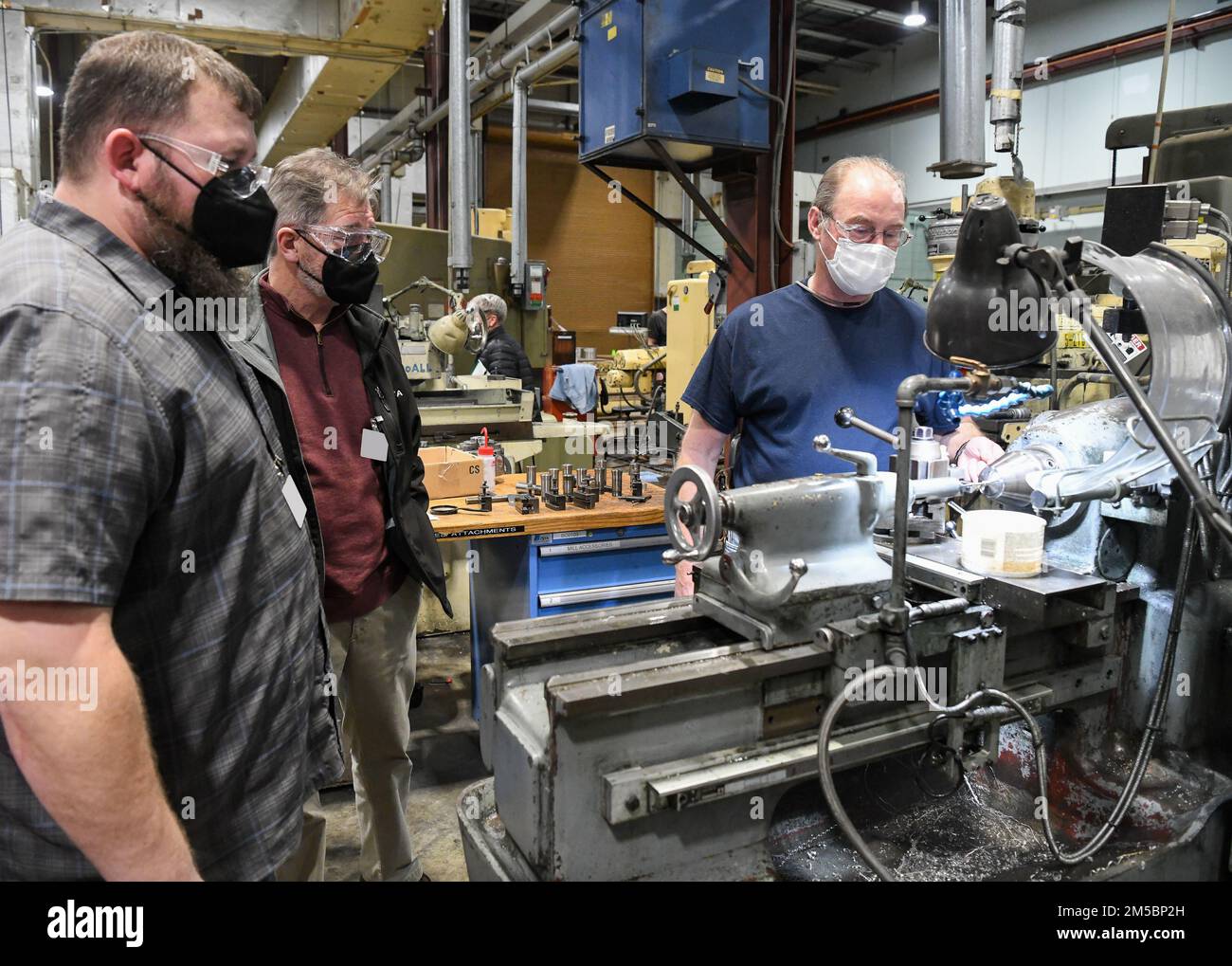 Jeff Fulks, right, a machinist for the Test Operations and Sustainment ...