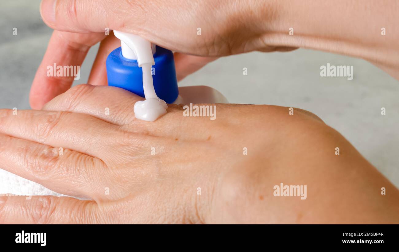 Woman hands applying hand cream, close-up view Stock Photo - Alamy