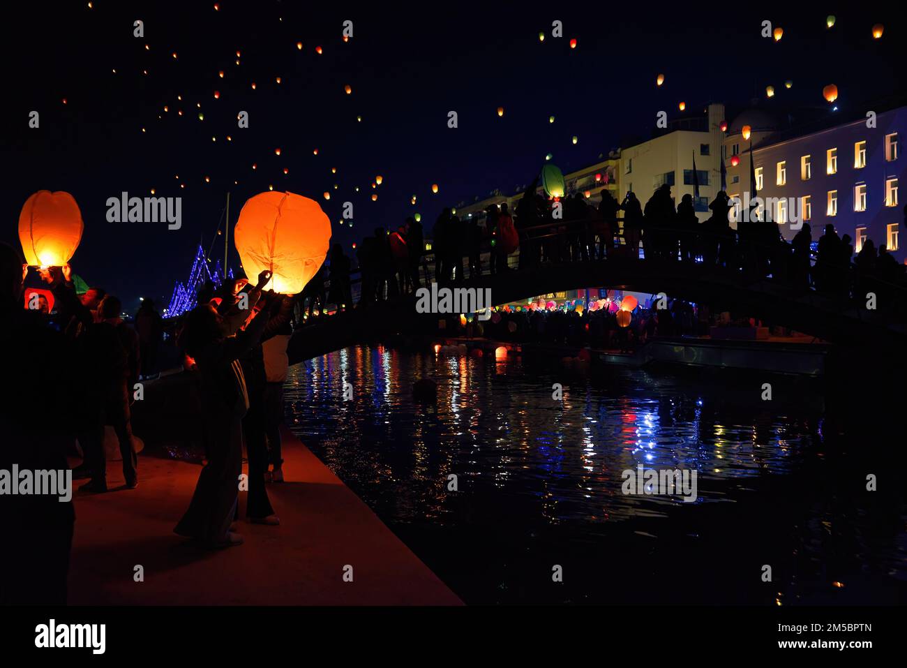 Sky lanterns floating in the sky. Volos lights festival. colorful ...
