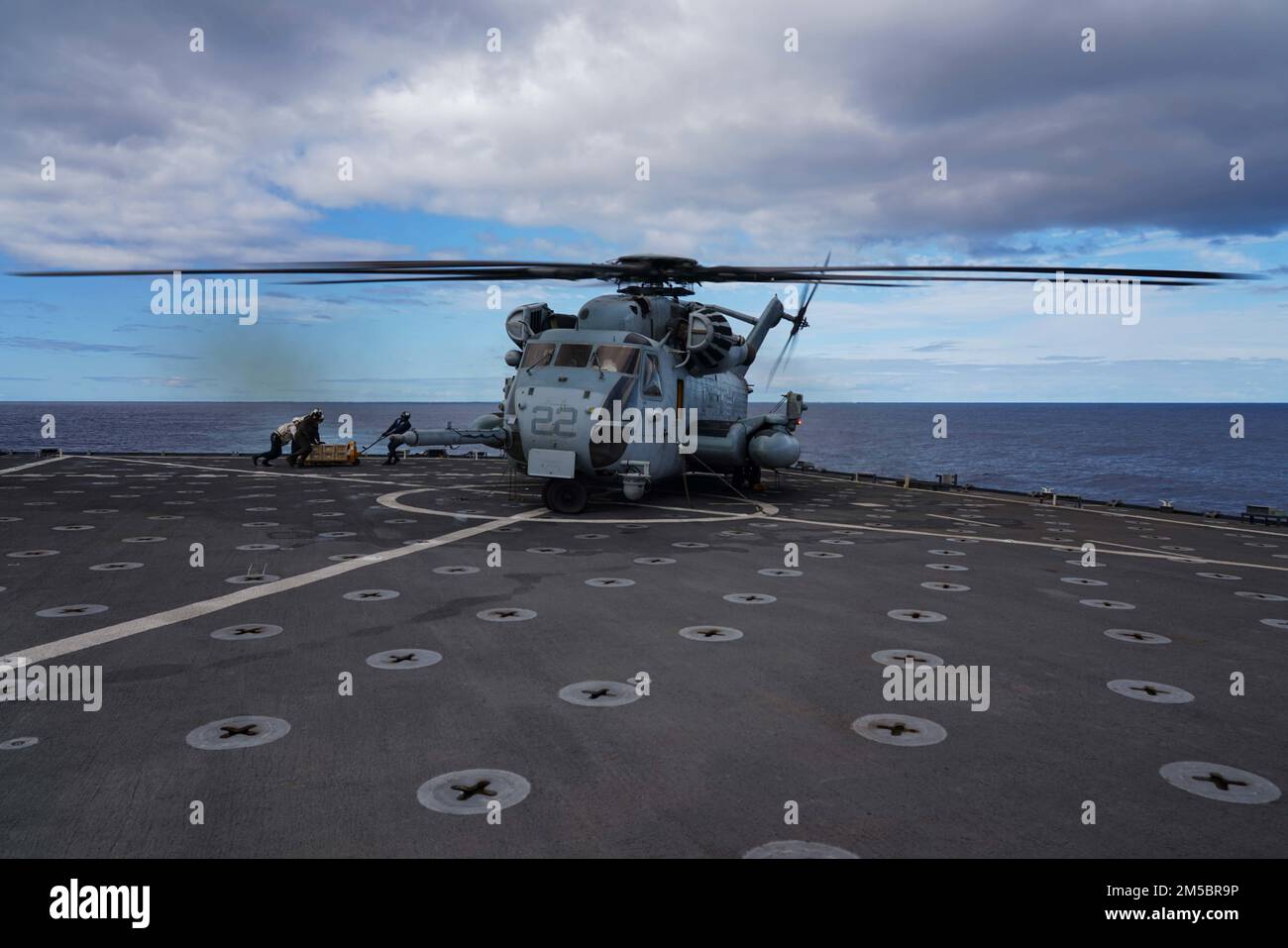 PACIFIC OCEAN (Feb. 24, 2022) Sailors and Marines load cargo onto a CH ...