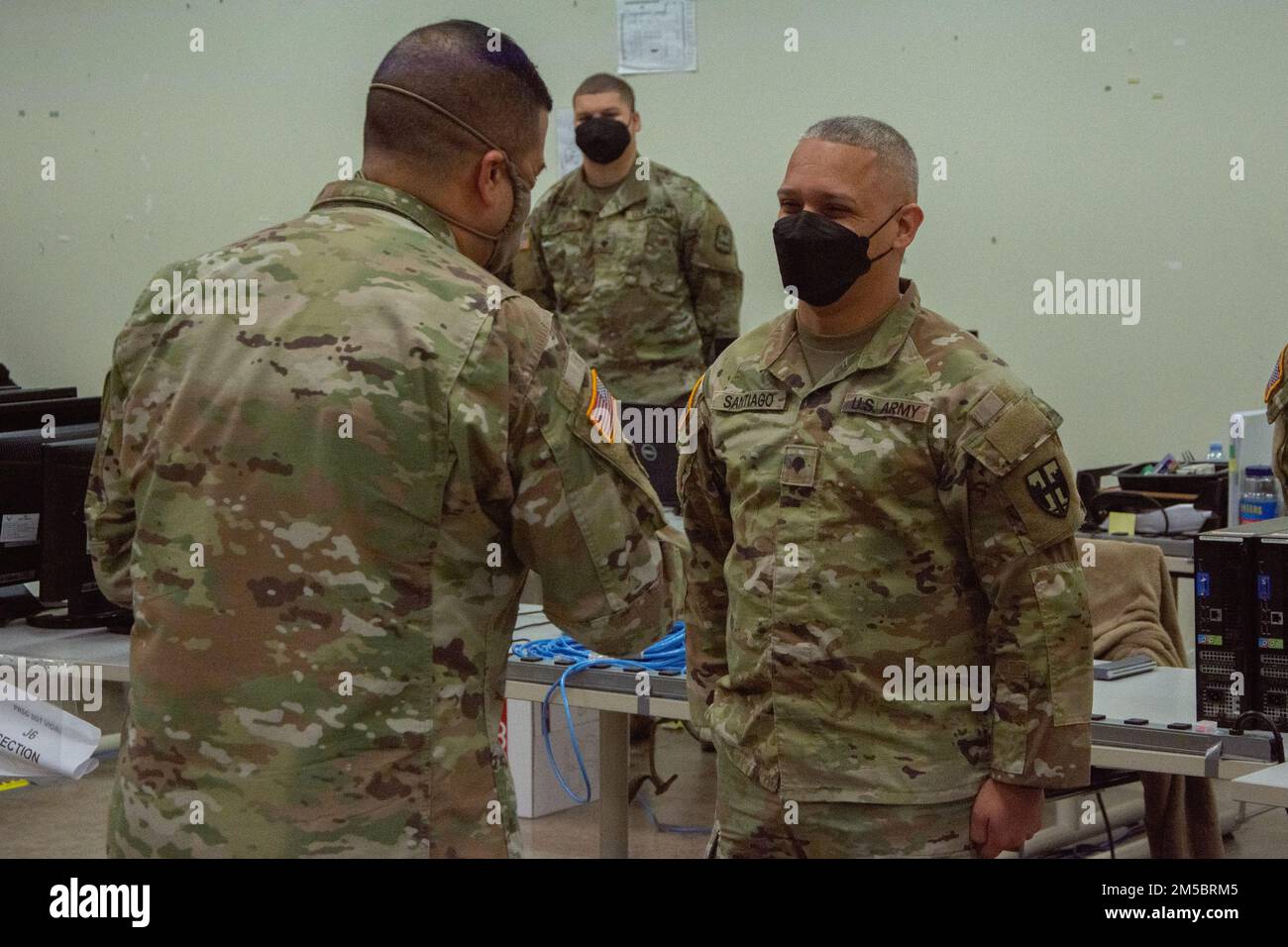 Spc. Jonathan Santiago, stand in the position of attention before Maj ...