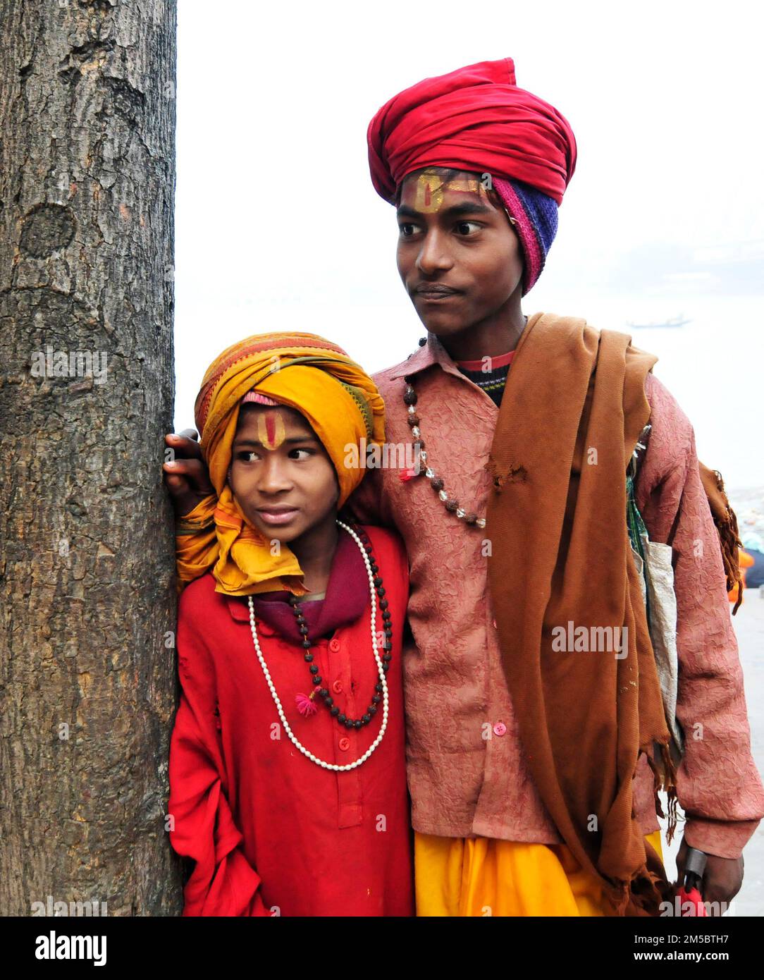 Sadhus gathered on the Mallick Ghat by the Hooghly river in Kolkata ...