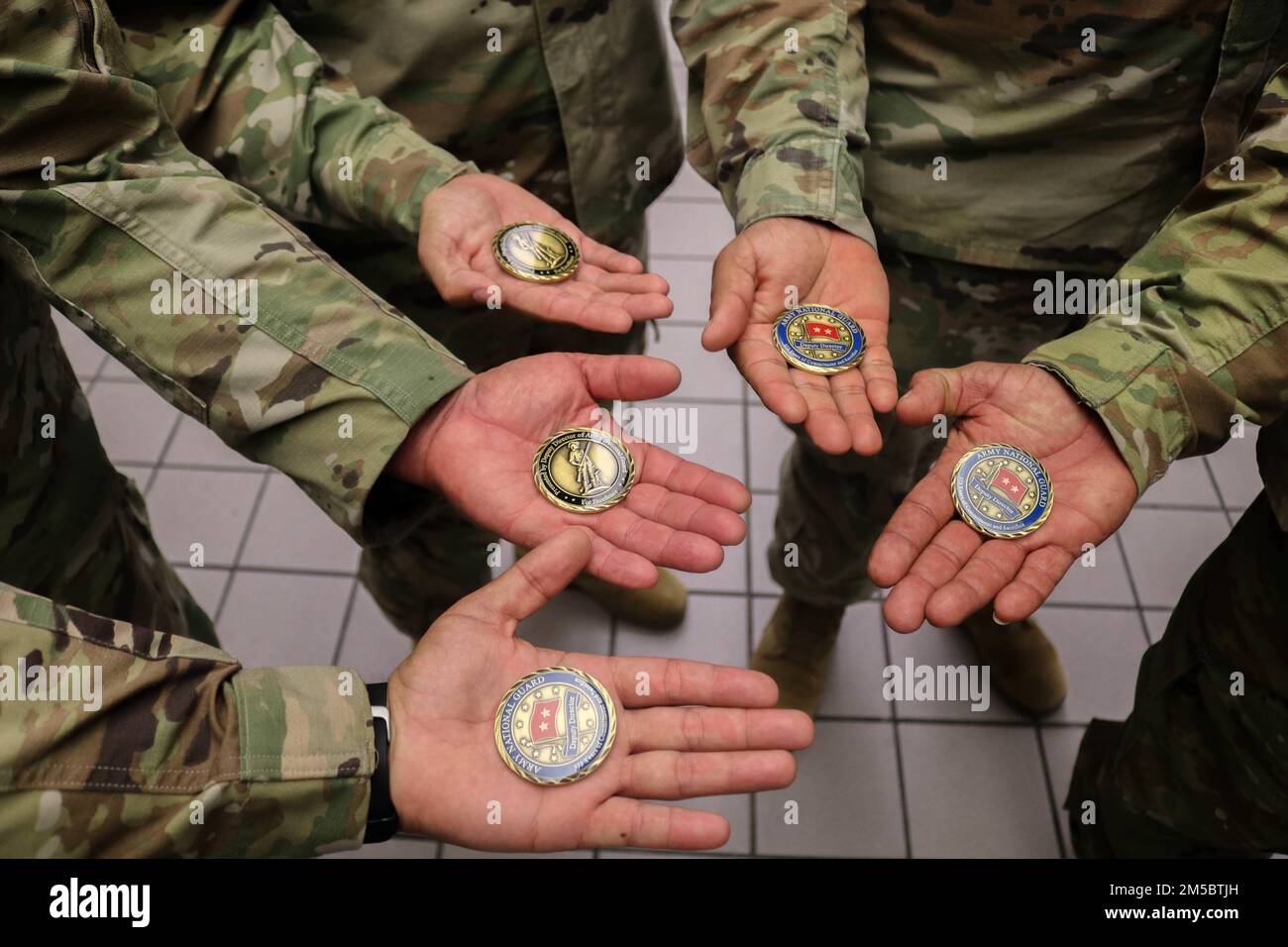 Citizen-Soldiers show the coin of excllence received from Maj. Gen ...