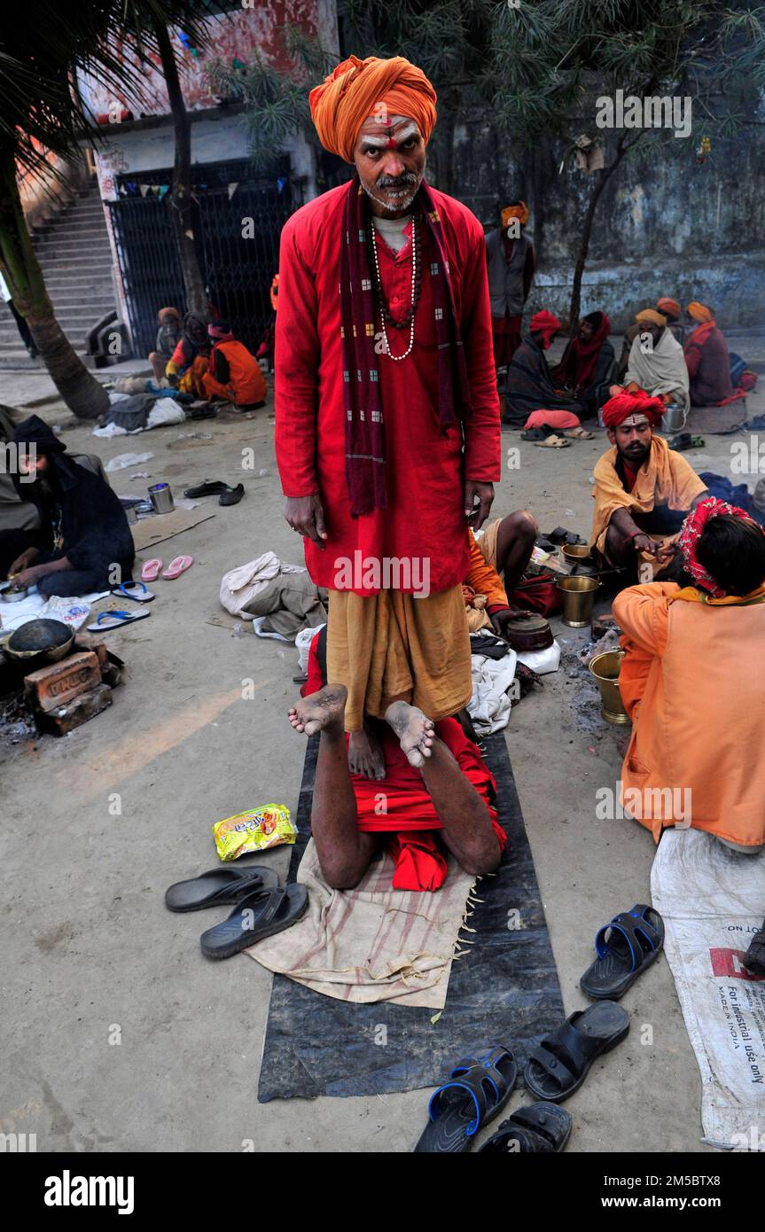 A Sadhu treating his fellow sadhu friend with Ashiatsu - walking on the ...