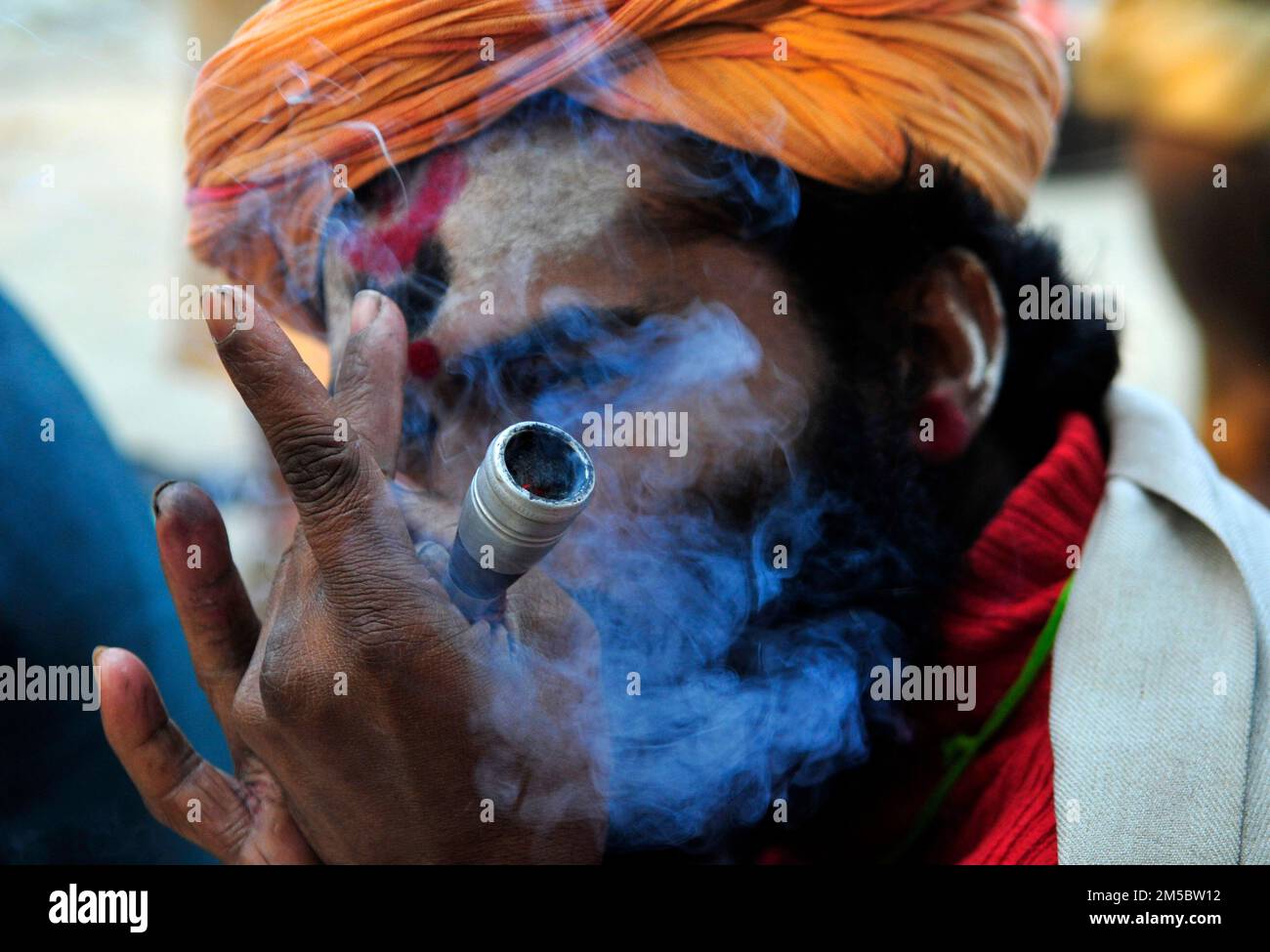 A Shaivite sadhu smoking chillum on the Mallick Ghat by the Hooghly ...