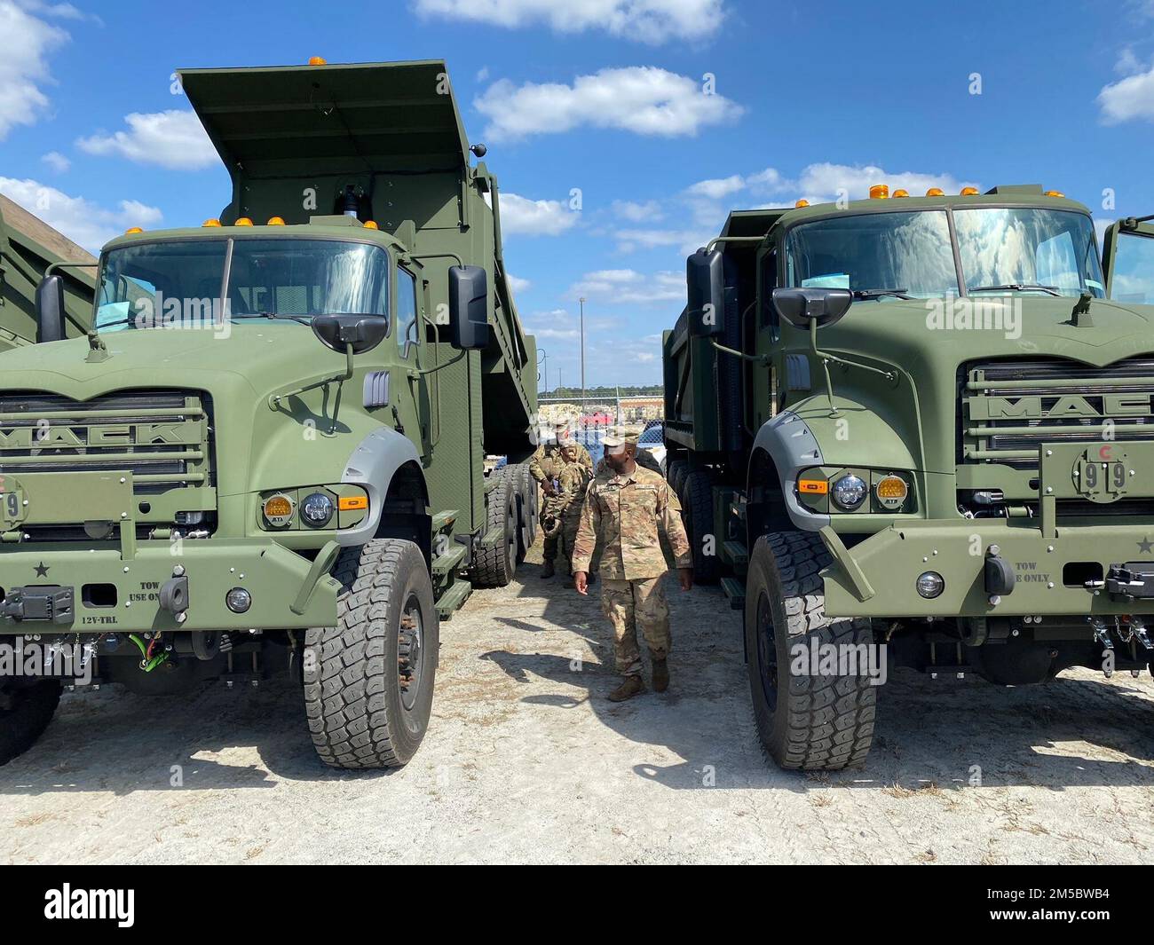 Sodiers from the 92nd Engineer Battalion inspect their new M917A3 heavy dump trucks, Feb. 23 on ...