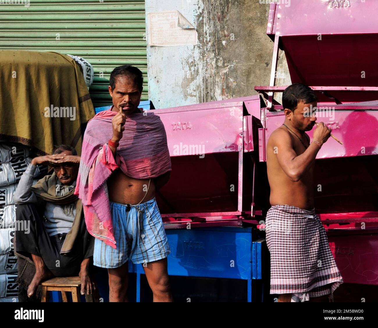 Bengali men brushing their teeth with a traditional toothbrush. Kolkata ...
