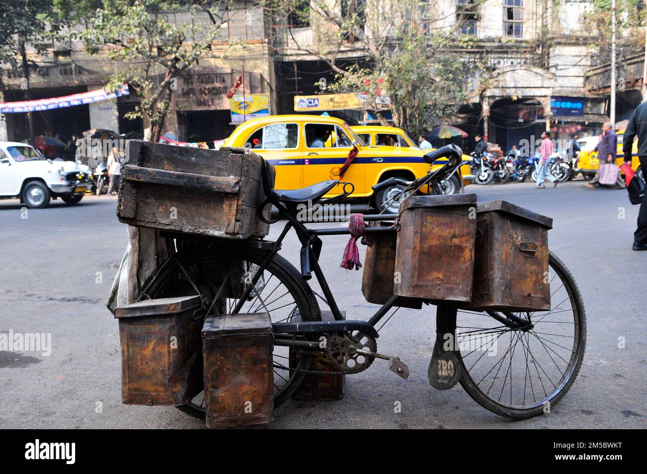 A bicycle loaded with oil cans in Kolkata, India Stock Photo - Alamy