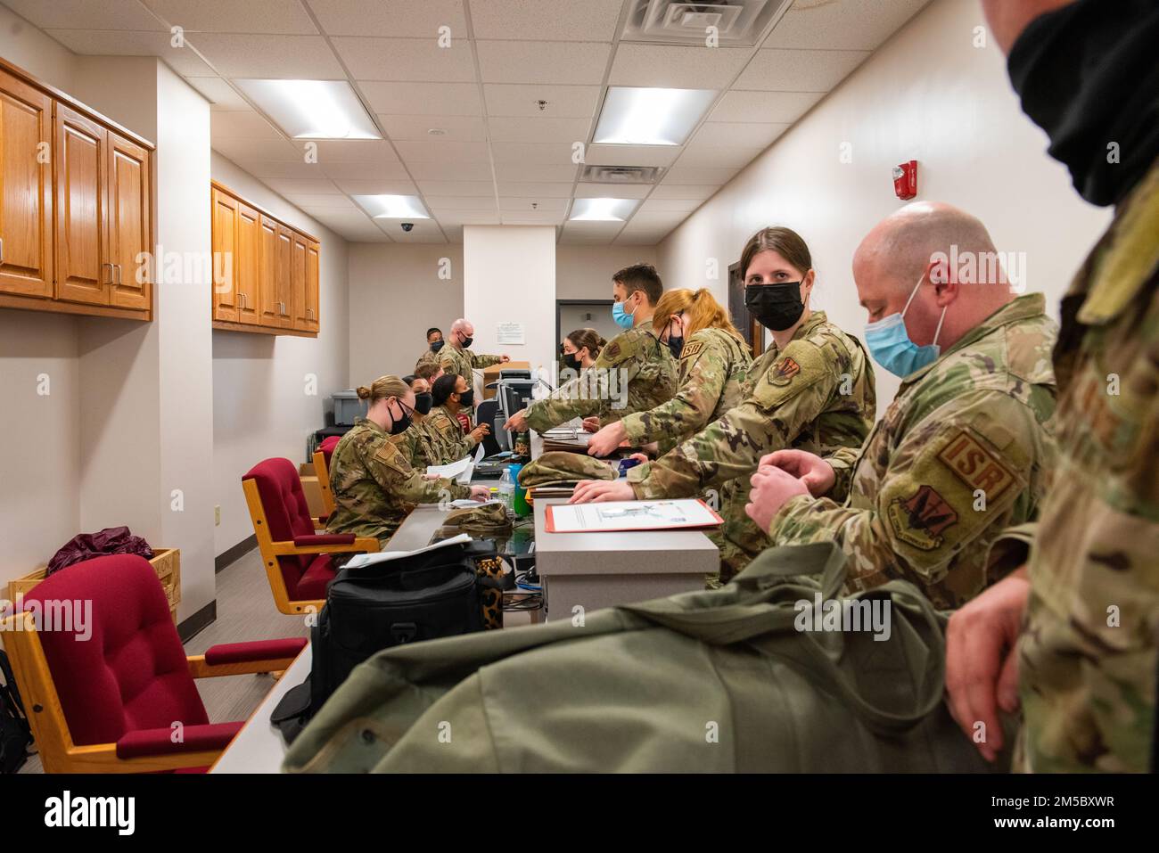 U.S. Air Force Airmen process through the pre-deployment line in ...