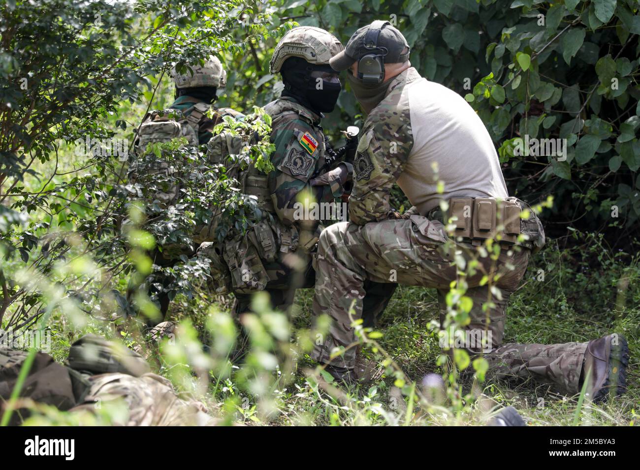 A British Ranger advises Ghana Special Forces Soldiers while patrolling ...