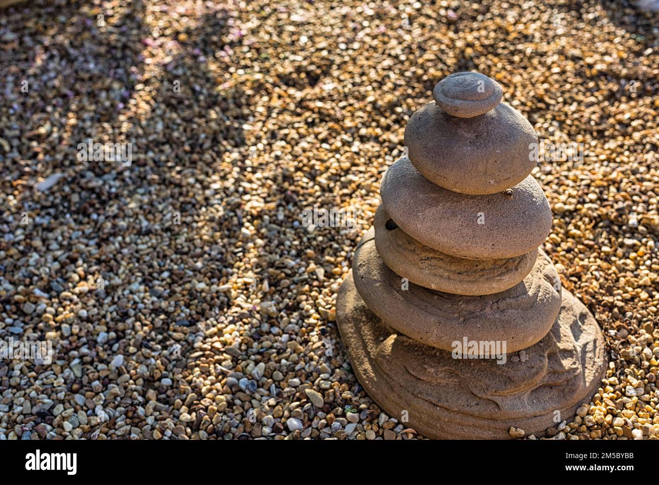 Stacked stones on gravel, cairn, cairn, backlight, symbol photo balance ...