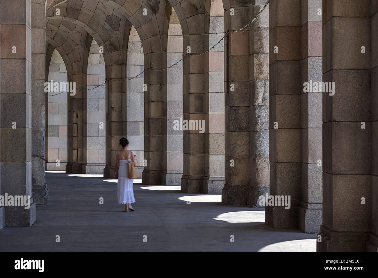 Lady in a white dress in the arcade of the Congress Hall, unfinished ...