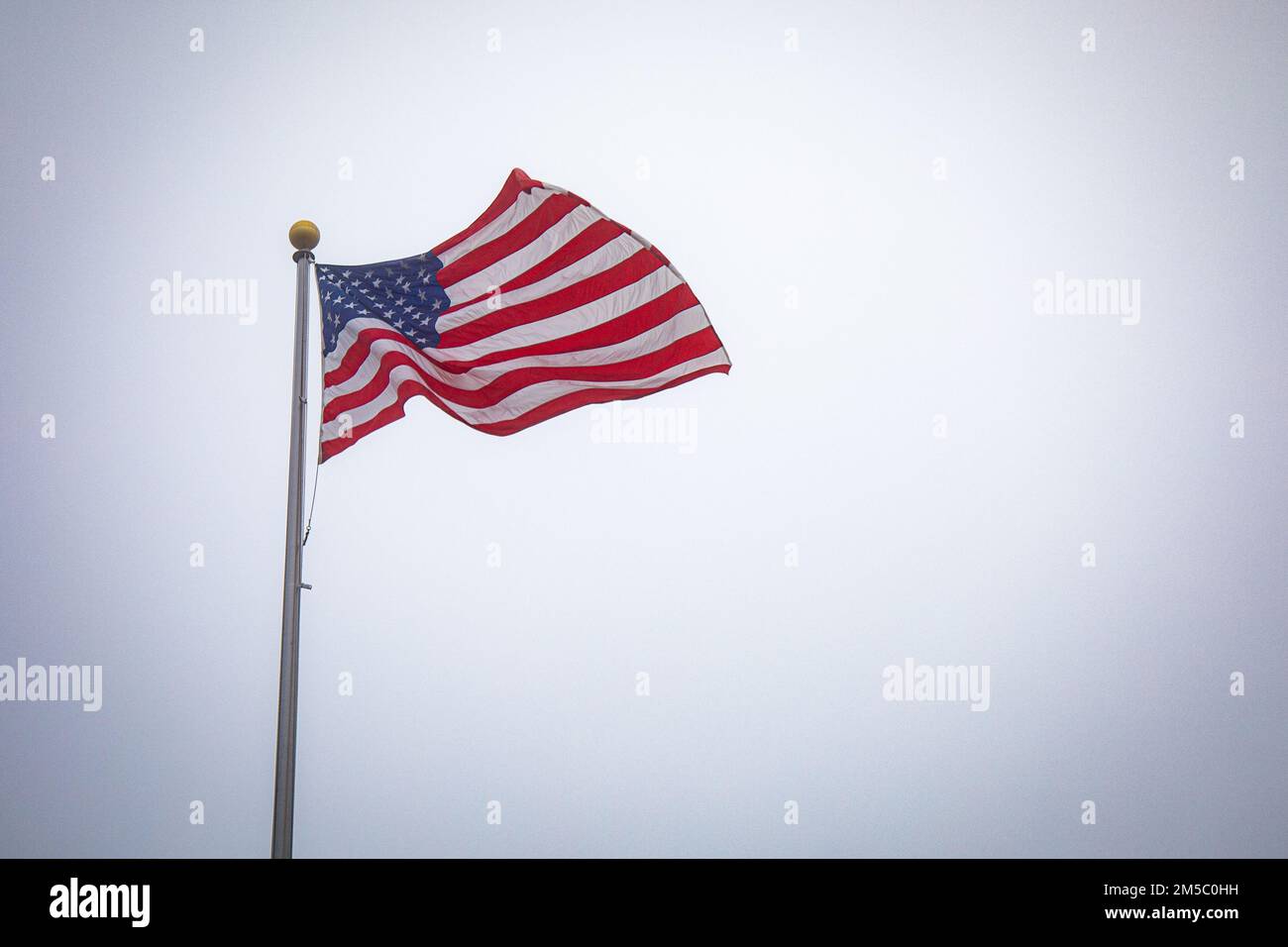 A U.S. flag flies on the newly installed flagpole after Morning Colors ...