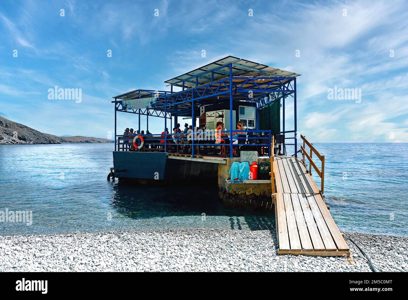 Tarvene and jetty, Sweet Water Beach, Paralia Glyka Nera, Crete, Greece ...