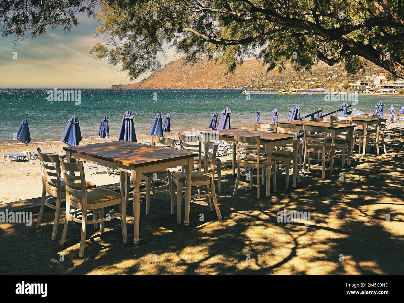Gastronomy, tables and chairs on the beach, Plakias, Crete, Greece ...