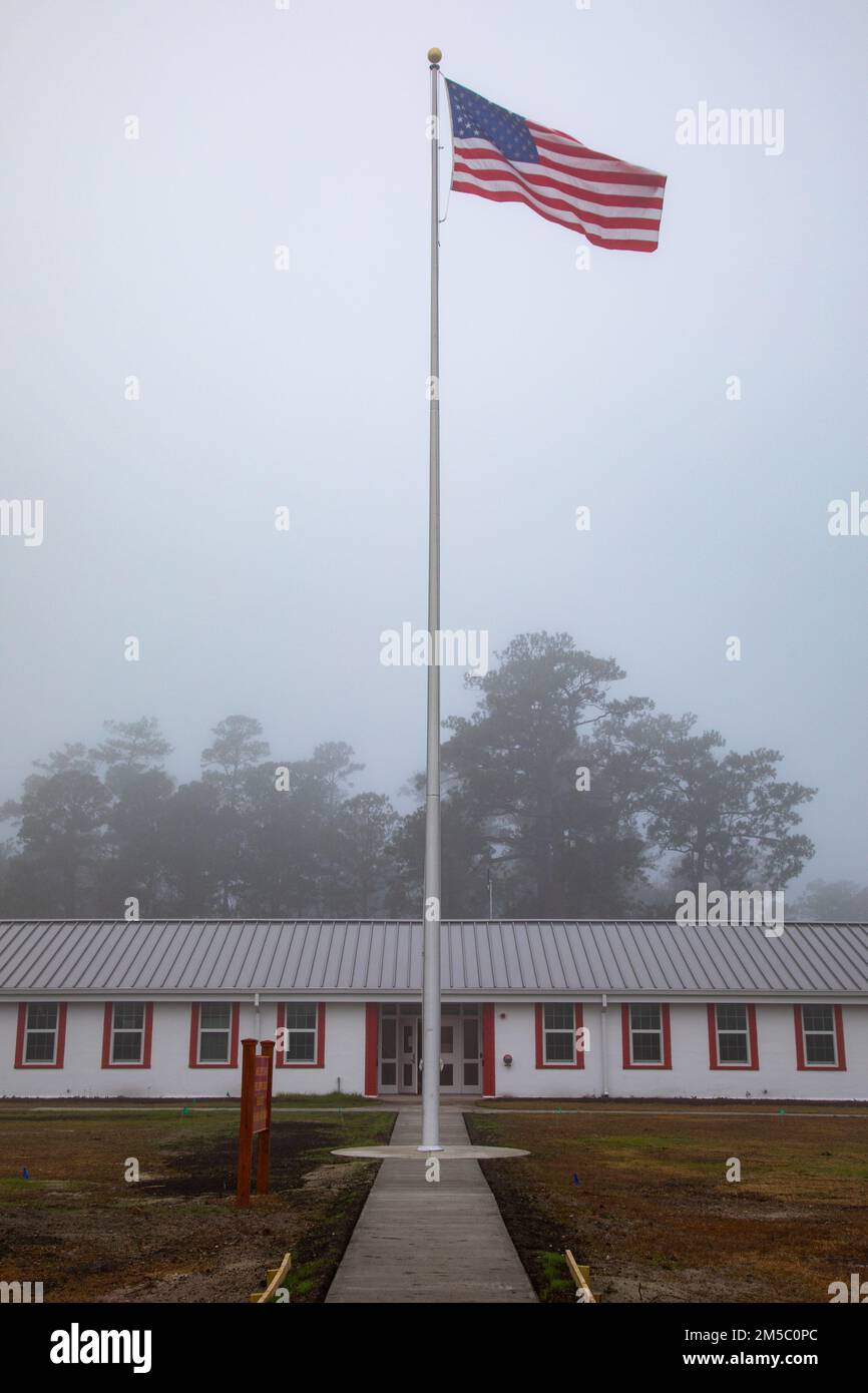 A U.S. flag flies on the newly installed flagpole after Morning Colors ...