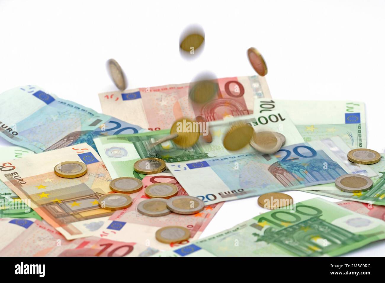 Euro coins fall on euro banknotes, rain of money, high cost, symbolic ...