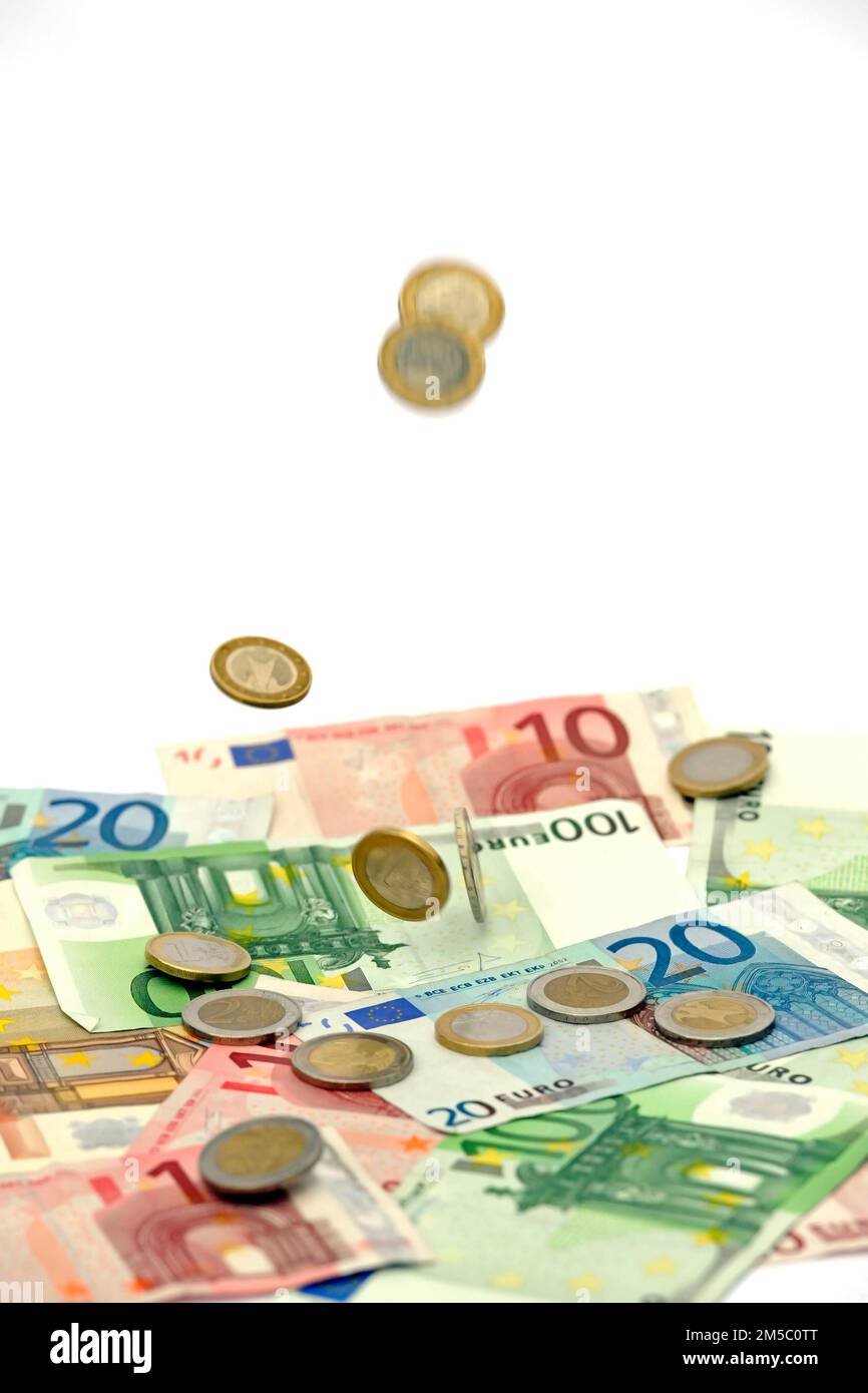 Euro coins fall on euro banknotes, rain of money, high cost, symbolic ...