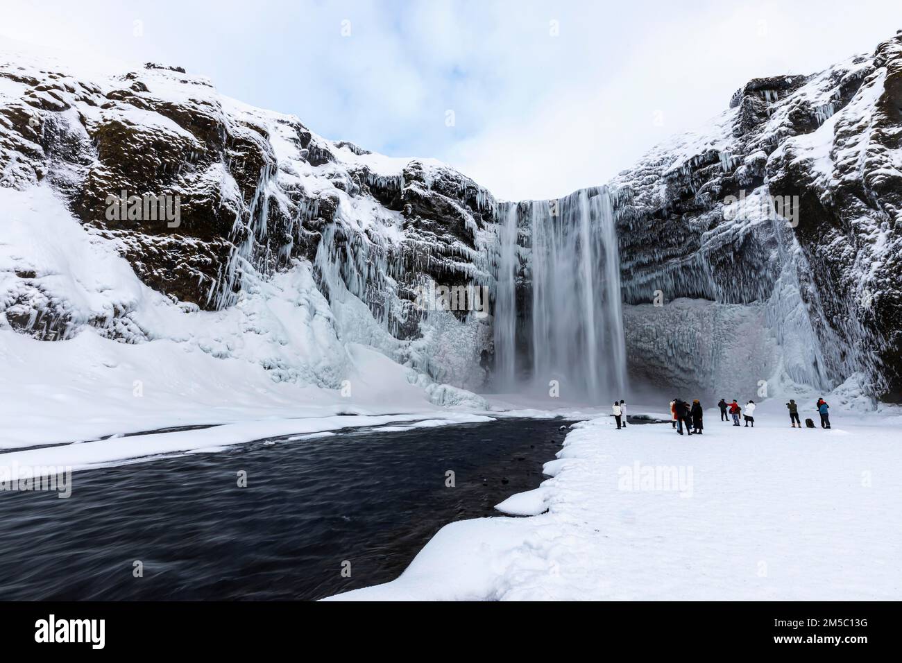 Skogafoss waterfall, snowy and icy rock face, Sudurland, Iceland Stock ...