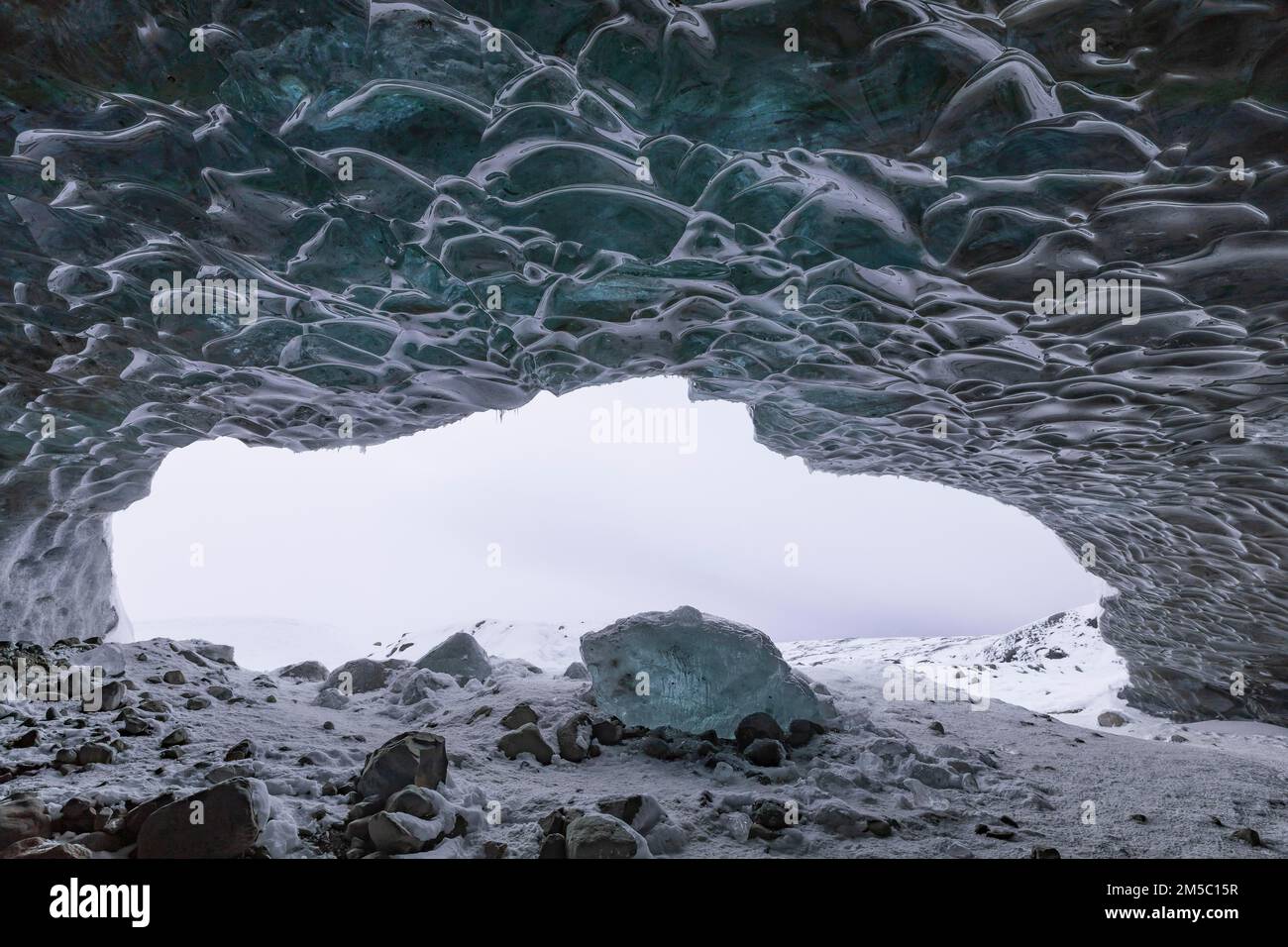 Aquamarine-coloured ice combs at the entrance to Proeng Ice Cave ...